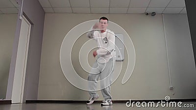 Down View of Young Guy Breakdancer Dances Hip Hop on Floor in Studio ...