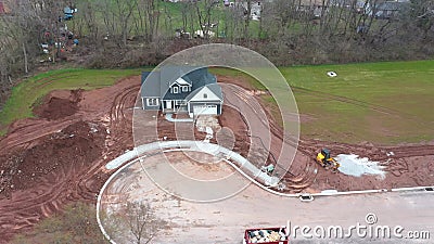 Drone Shot of a Countryside House with a Construction Tractor Working ...