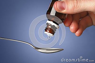 Drop Of Cough Medication Dripping Into Teaspoon Royalty-Free Stock ...