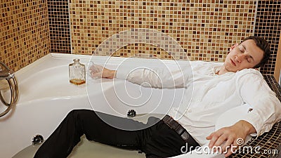 Drunk Man with Alcohol is Lying in a Bath with Water Stock Footage ...