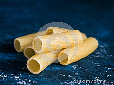 Dry Pasta Tortiglioni Closeup On A Dark Blue Background. Stock ...