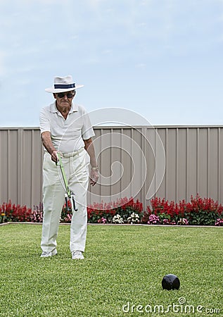 Elderly Man Rolling Ball With Artificial Bowling Arm. Stock Photo ...