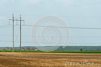 An Electric Pole In A Field With Wheat. Laying Of High-voltage Cables ...