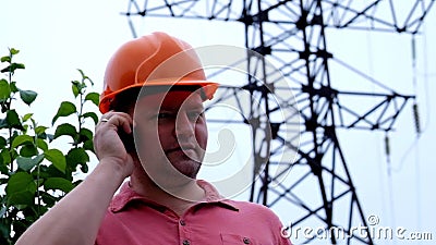 Electrical Engineer Working. Talking on the Phone and Working on the ...