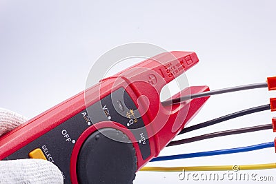 The Electrician Measures The Current In The Phase Wire With A Meter ...