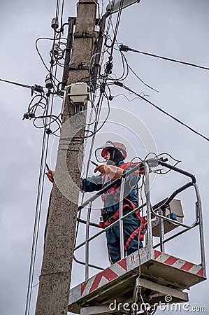 Electricians Work On Inspection And Replacement Of Lighting Poles ...