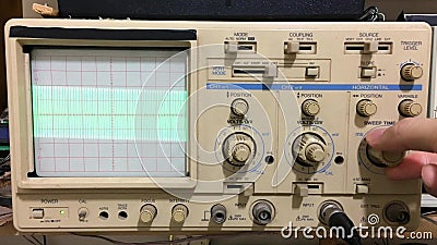 Electronics Working with Oscilloscope and Sine Wave Shown on ...