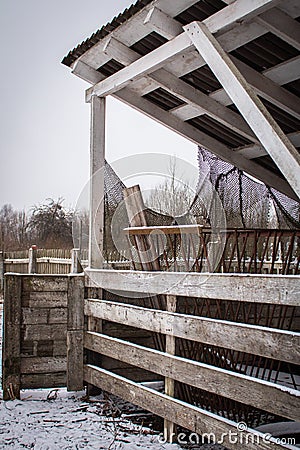 Empty Cattle Paddock In The Foreground With A Hay Feeder Stock Photo ...
