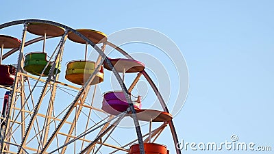Empty Ferris Wheel Spinning Against Blue Sky. Stock Video - Video of ...