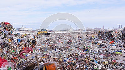 A Landfill Loader Moves between Compressed Garbage Piles. Enviromet ...