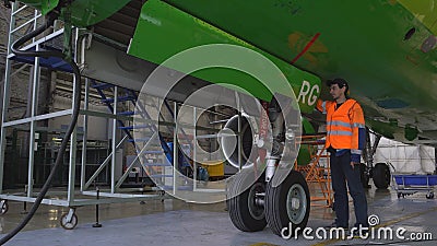 Engineer Checks The Operation Of The Hatch Of The Front Landing Gear Of ...