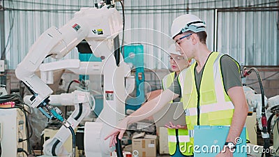 Engineer Man and Woman Talking and Explaining about Robot Arms ...