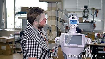 An Engineer Takes Off a Robots Face Panel. Stock Footage - Video of ...