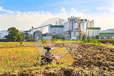 Ethanol Industrial Refinery With Farm Tractors In The Foreground ...