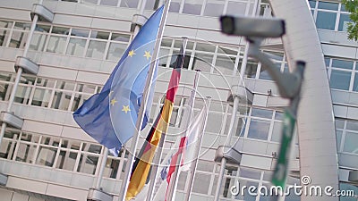 EU Flags Wave Behind A Cctv Security Camera Stock Video - Video of ...