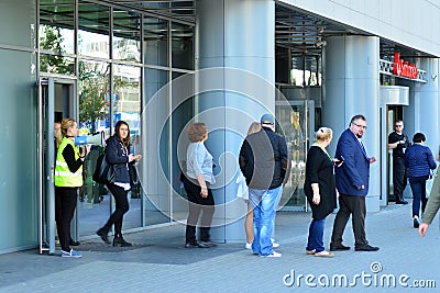 Evacuation Of An Office Building. People Exit The Building On Exit Door ...
