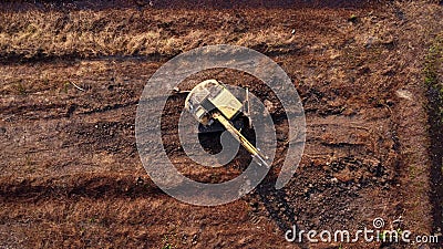 Excavator Dig Ground at Construction Site. Aerial View of a Wheel ...