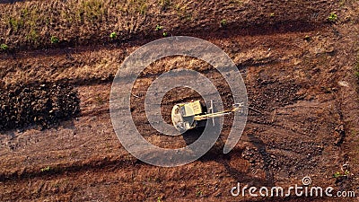 Excavator Dig Ground at Construction Site. Aerial View of a Wheel ...