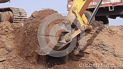 An Excavator Loads Moorum Soil into a Tractor at Construction Land ...
