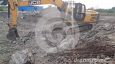 Excavator Removing Rock and Soil from the Construction Site Stock Video ...
