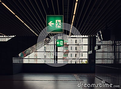 Exit Signs Illuminated With The Green Light In A Train Station ...