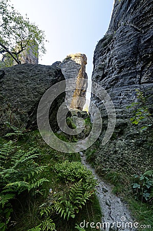 An Extremely Narrow Path Going In Between Tall Rock Formations Royalty ...