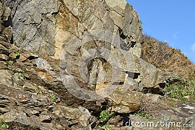 Face Shape Rock On Cliff With Textured Layers And Shapes. Royalty-Free ...