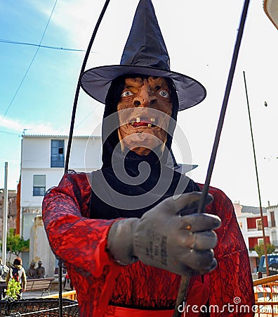 Face Of A Toothless Witch Doll Dressed In Red With Witch Hat Editorial ...