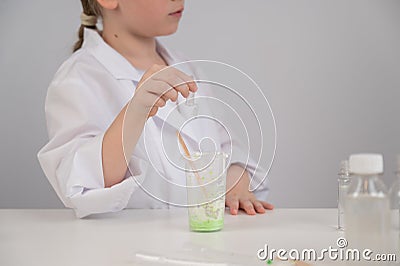 Faceless Girl Doing Chemical Experiments On A White Background. Making ...