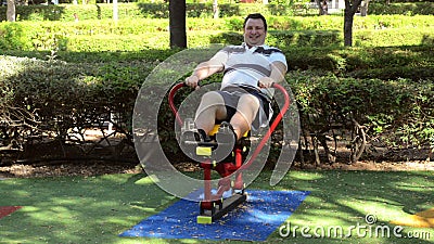 Fat Man on the Rowing Machine Stock Video Footage - Video of limbs ...