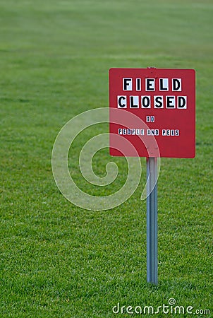 Field Closed Sign In A Grass Field Stock Image - Image: 12980021