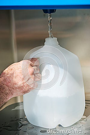Filling Water Jug Stock Photo - Image: 53848432