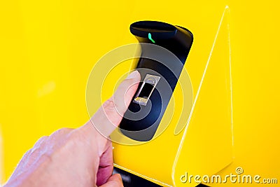 Finger Biometric Scanner With Blurry Finger On Yellow Machine Stock ...