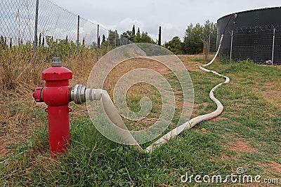 Fire Hydrant With Hose Connected To Water Tank Royalty-Free Stock ...