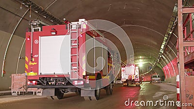 Fire Trucks Entering a Large Tunnel with Red Lights for Rescue Stock ...