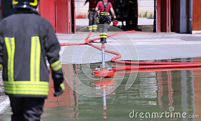 Firefighter Positions A Powerful Fire Hydrant During The Exercises ...