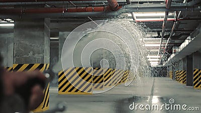 A Firefighter is Testing the Fire Safety System. Test Start of Water ...