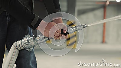 The Fireman Closes the Fire Hydrant. Fire Fighting Opening the Faucet ...