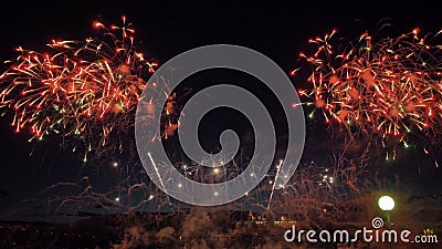 Firewok Bombs are Bursting in Air. Crowds of People are Looking at ...