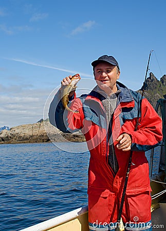 Fisherman With Small Fish Royalty-Free Stock Photo | CartoonDealer.com ...