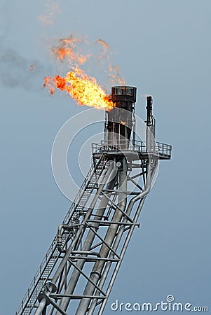 Flare boom nozzle and fire on offshore rig - Stock Image - Everypixel