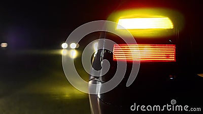 Flashing Orange Blinker Light on Sport Car Parked on Side at Night ...