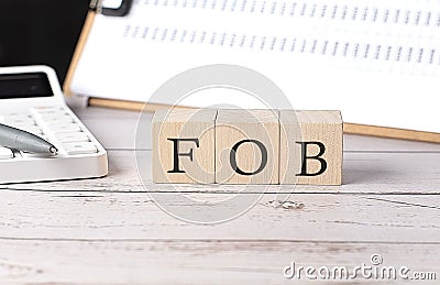 FOB Word On A Wooden Block With Clipboard And Calcuator Stock Photo ...
