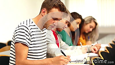 Focused Students Listening in Lecture Hall and Taking Notes Stock Video ...
