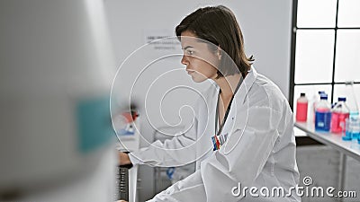 Focused Young Hispanic Woman, A Beautiful Scientist, Deeply Absorbed ...