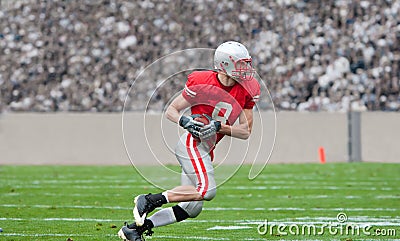 Football Wide Receiver Making a Leaping Catch Stock Image - Image of ...