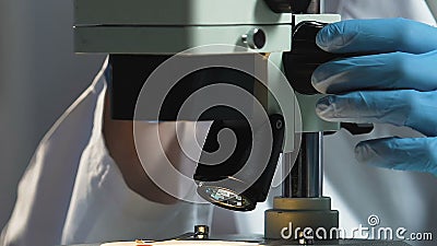 Forensic Scientist Carefully Examines Physical Evidence Under ...