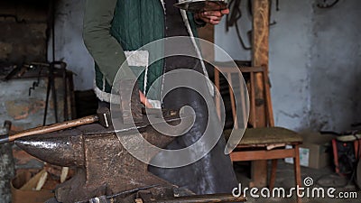 Forge Workshop. Smithy Manual Production. Smith with Hammer Hit Scoop ...