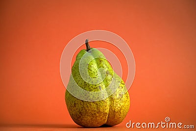 Green Pear In The Shape Of A Female Figure On Orange Background Stock ...