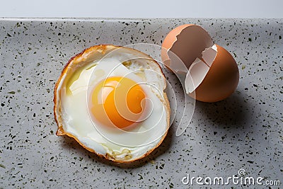 Fried Egg On Speckled Surface With Intact Yolk, Broken Shell, Simple ...